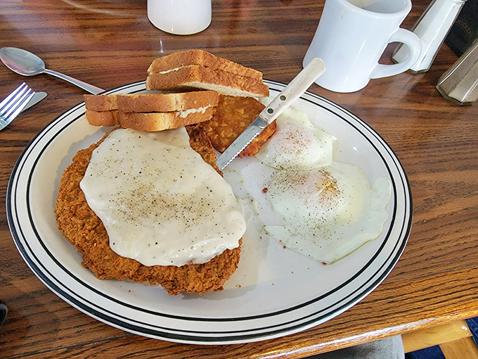 The holy trinity of comfort food: perfectly breaded country fried steak, eggs with just-right yolks, and gravy that should be classified as a controlled substance.
