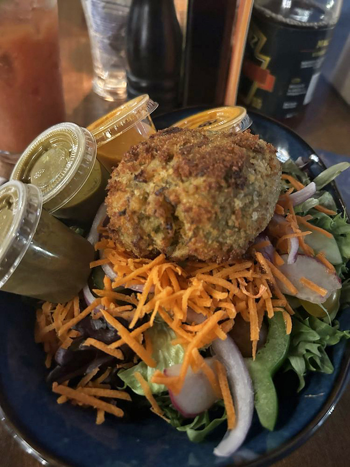 Garden-fresh greens playing the perfect backdrop for the real celebrity&mdash;a crab cake with a tan that would make George Hamilton jealous.