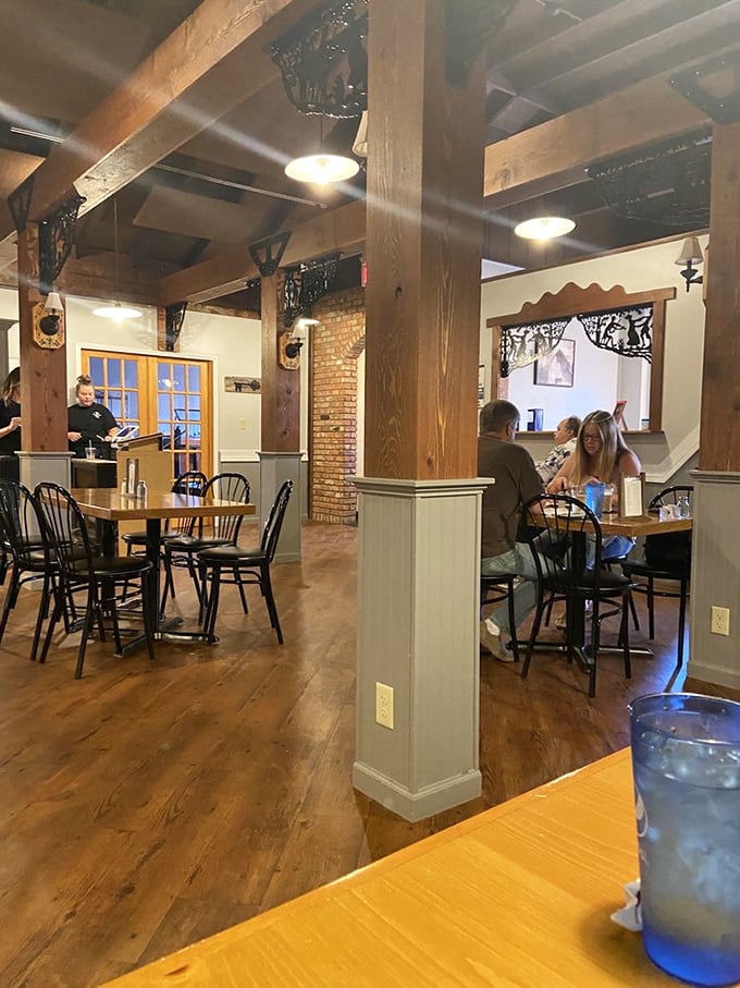 Exposed beams, brick walls, and that warm glow&mdash;dining rooms like this make you want to linger like it's Sunday dinner at Grandma's.