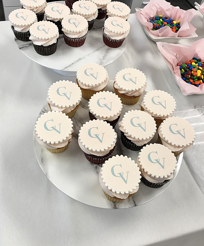 Monogrammed cupcakes await their moment of glory at a celebration, proving that personalization and buttercream are the ultimate power couple.