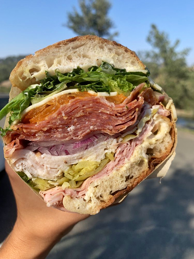 This isn't just a sandwich; it's a skyscraper of flavor with perfect structural integrity. Each layer plays its part in a symphony of deliciousness.