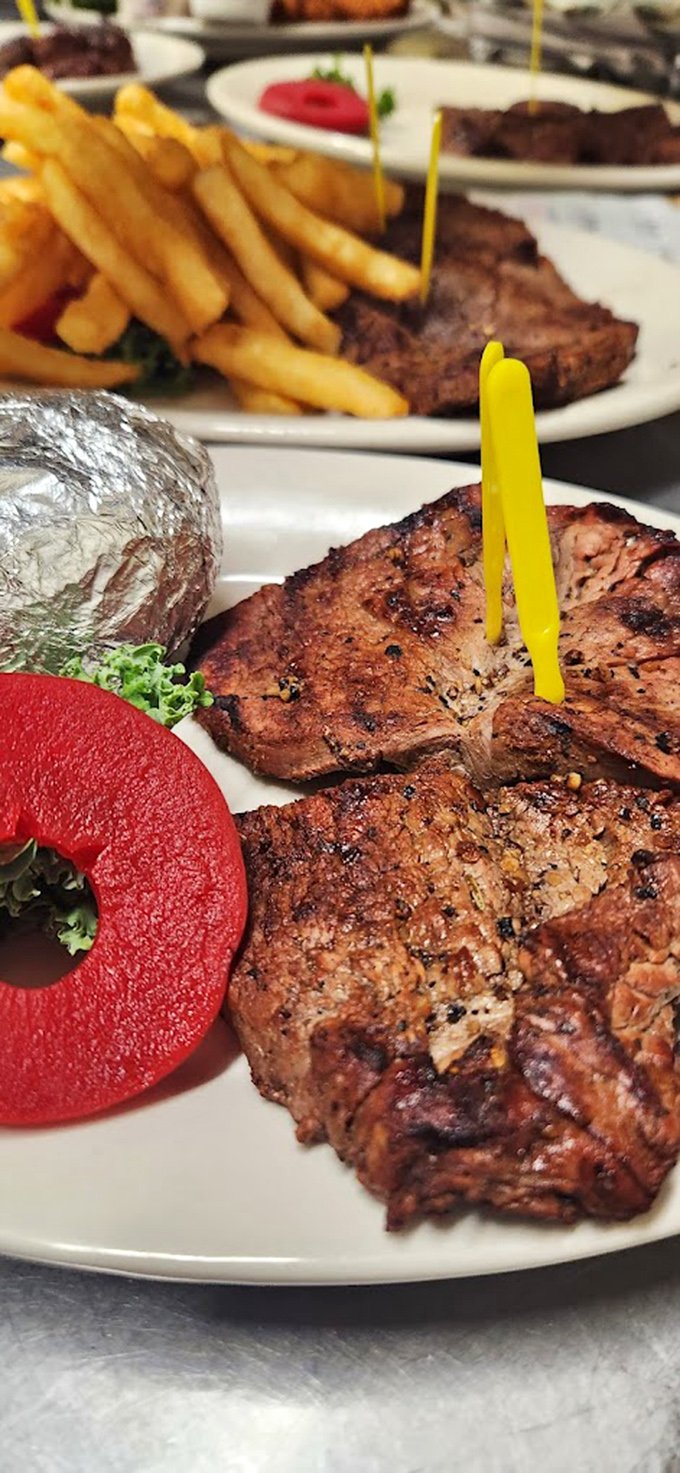 The kind of steak that makes vegetarians question their life choices. That sear! That color! That foil-wrapped potato standing by for backup!