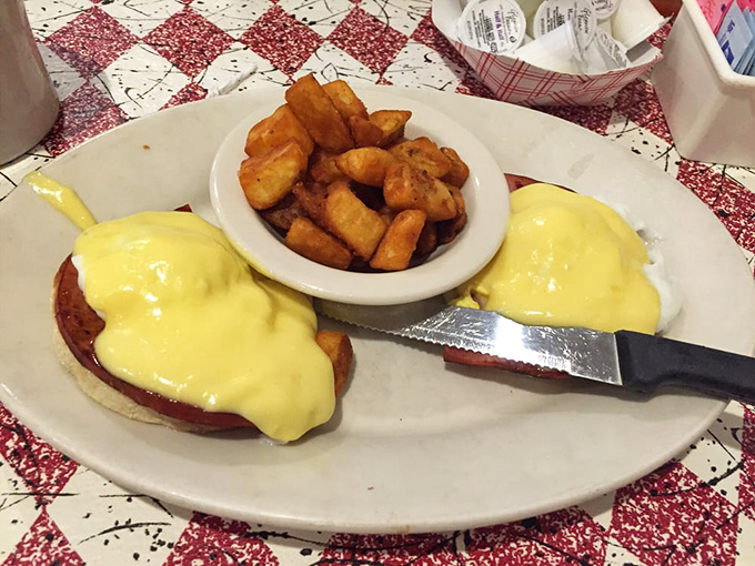 Eggs Benedict that would make a cardiologist wince and your grandmother nod in approval, with hash browns that shatter like glass at the touch of a fork.