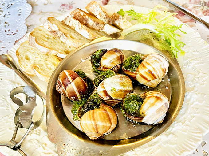 Escargot: where garlic butter does the heavy lifting of making you forget you're eating snails. Trust me, your taste buds will send thank-you notes.