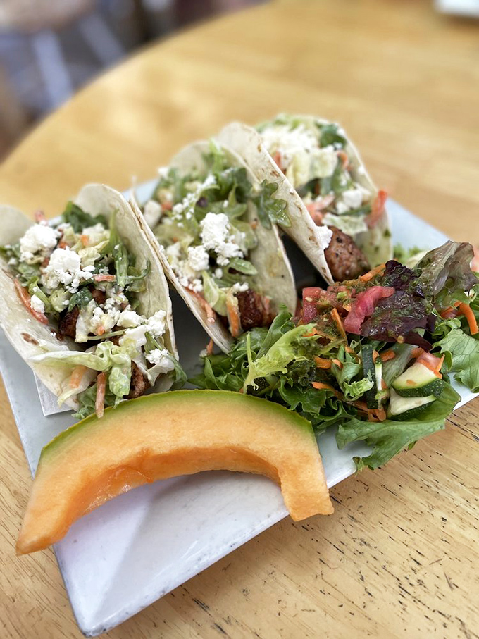 These fish tacos aren't just food; they're a beach vacation for your taste buds, complete with a cabbage slaw "umbrella" and crumbled cheese "sand."