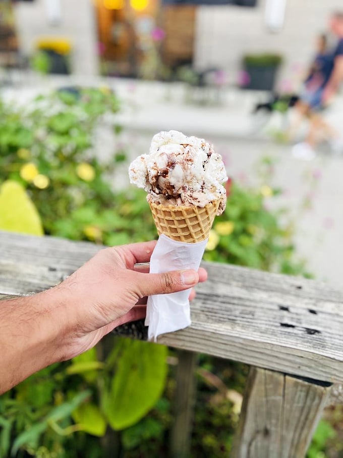 This waffle cone isn't merely holding ice cream; it's cradling what appears to be the answer to life's most pressing Monday questions.