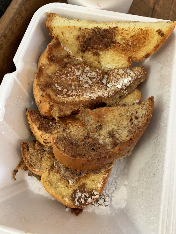 Golden-edged French toast triangles dusted with sweet surrender. The kind of breakfast that makes you wonder why we don't eat dessert first every day.