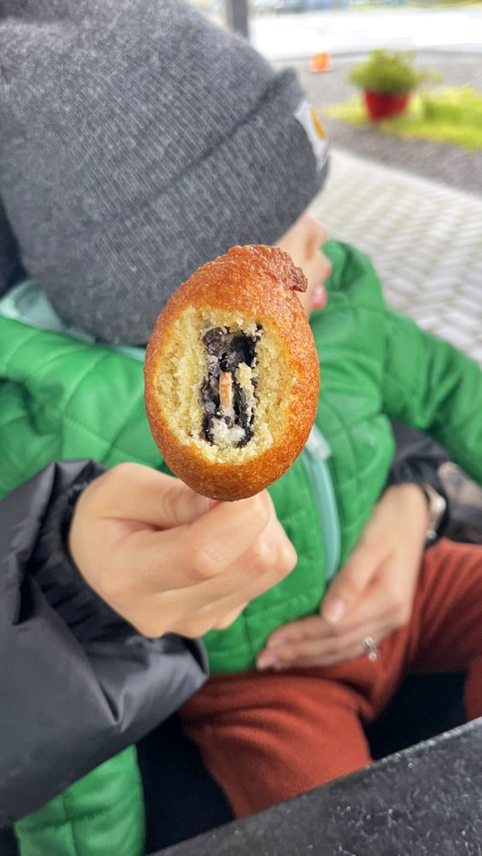 Culinary innovation at its finest&mdash;a bite reveals the unexpected treasure of a chocolate cookie hiding inside that familiar golden exterior. 