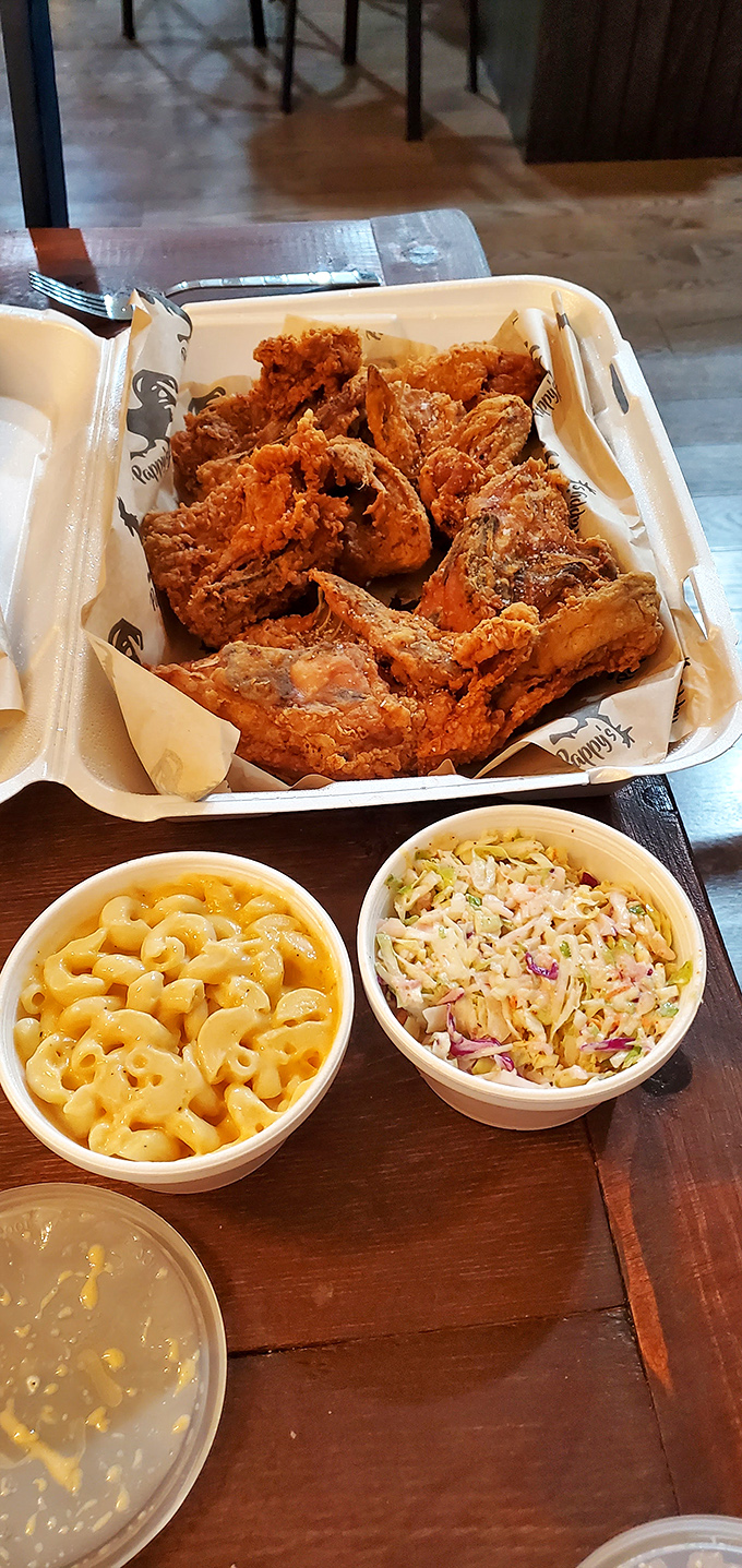 The holy trinity of comfort: perfectly fried chicken, creamy mac and cheese, and fresh coleslaw. Some combinations are eternal for good reason.