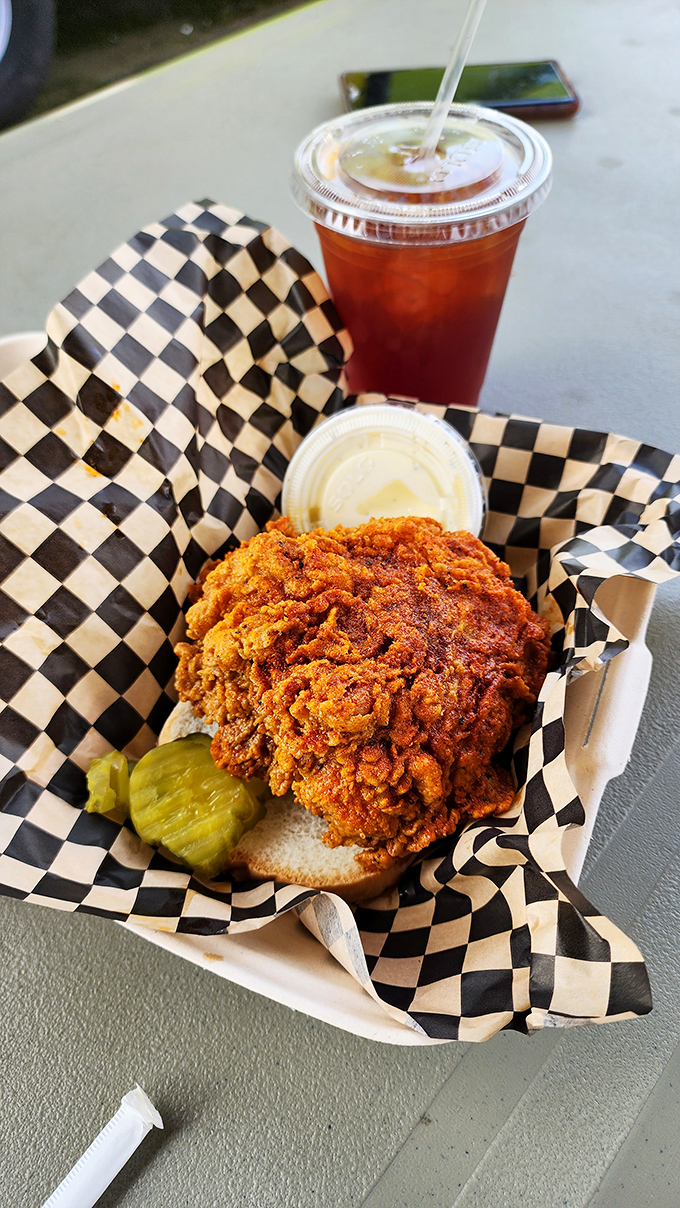 That perfect bite: spicy chicken, tangy pickle, and a cooling sip of sweet tea. It's the holy trinity of Southern comfort food. 