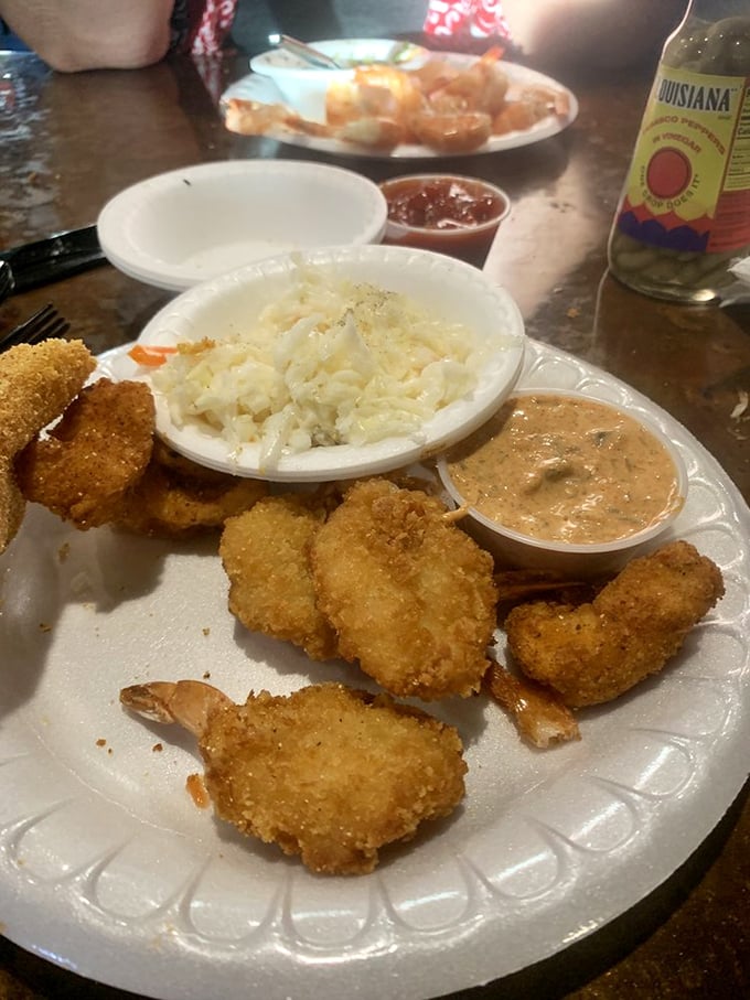 A symphony of textures: crispy fried shrimp, creamy coleslaw, and that special sauce that makes you contemplate drinking it directly.