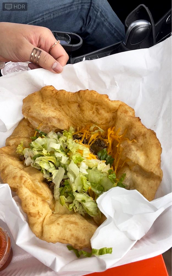 Taco Tuesday, elevated! Crispy-yet-tender fry bread cradles seasoned beef, fresh lettuce, and cheese&mdash;a handheld masterpiece that demands both napkins and respect.