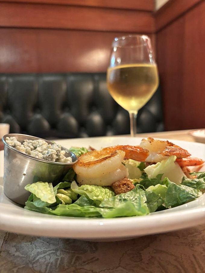 Plump, perfectly grilled shrimp perched atop crisp romaine like jewels on a green crown. That little tin of blue cheese dressing is about to make everything even better.