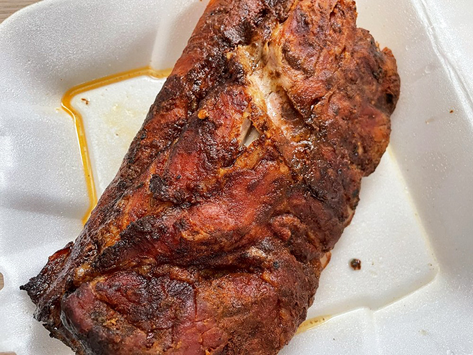 Ribs with a bark so perfect you'll want to frame it. The smoke ring is practically a halo—appropriate for this heavenly creation.