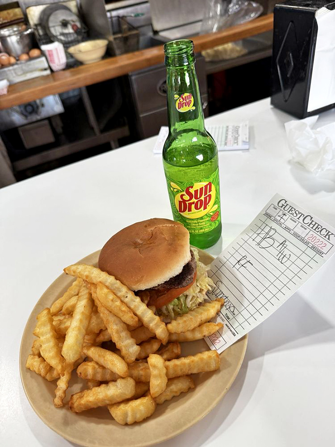 The holy trinity of American comfort food: a juicy hamburger, crispy fries, and an ice-cold SunDrop. Some combinations are simply written in the stars.