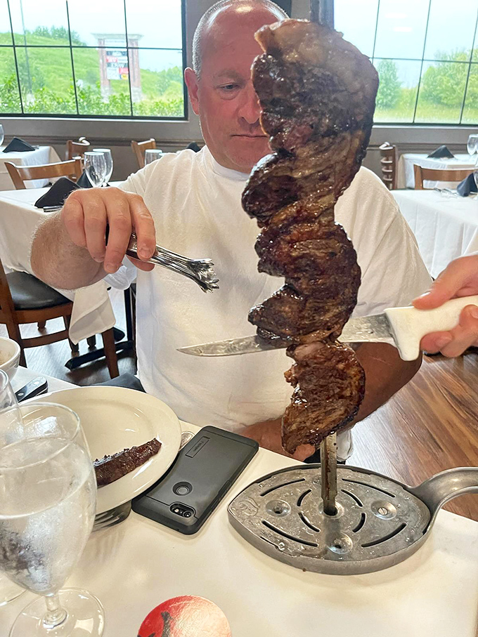 
The knife slices through the meat with surgical precision, revealing that perfect medium-rare interior. This isn't just dinner; it's performance art with protein. 