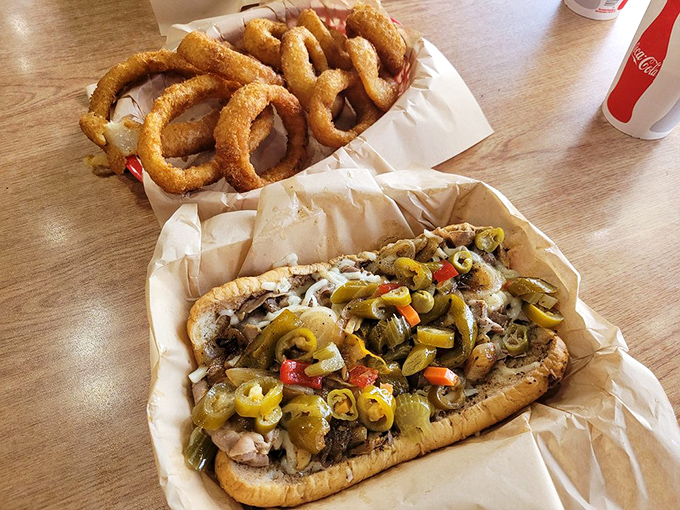 The Italian beef sandwich arrives with golden onion rings, a combination that should be enshrined in the Fast Food Hall of Fame.