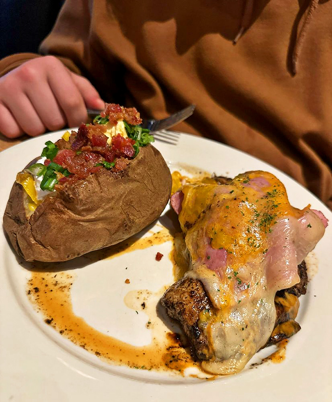 When a loaded baked potato and steak with melted cheese share a plate, it's not dinner&mdash;it's destiny. This is what food dreams are made of.