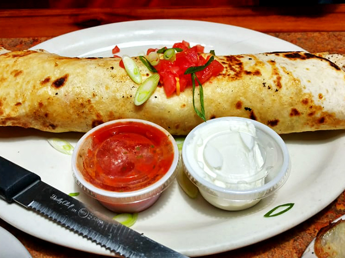 This burrito isn't just a meal; it's a commitment. Stuffed with enough filling to feed a small cattle drive, it's Florida's answer to Tex-Mex.