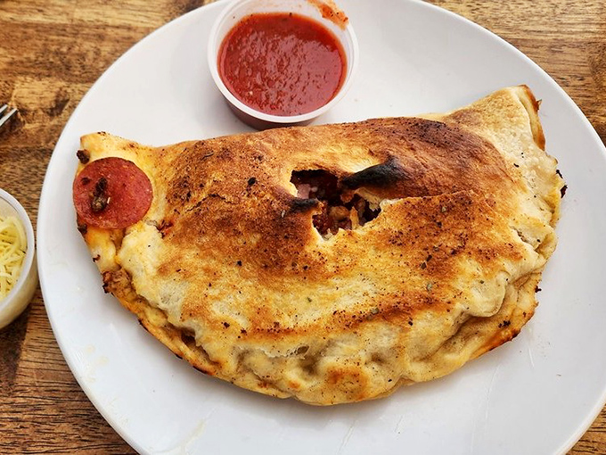 The calzone: Italy's original "hot pocket," but with actual flavor and a satisfying crispness that makes the commercial version cry with shame.