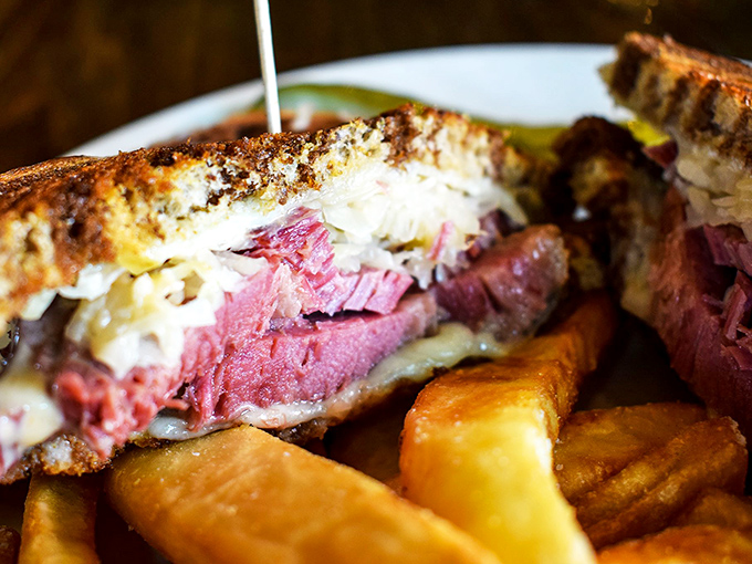 Look at that cross-section! The corned beef's ruby interior reveals itself like a culinary jewel, nestled between perfectly grilled marble rye.