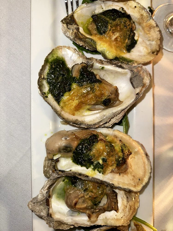 Oysters Rockefeller done right &ndash; briny, buttery jewels topped with spinach and cheese that would make even the most dedicated landlubber reconsider their life choices.