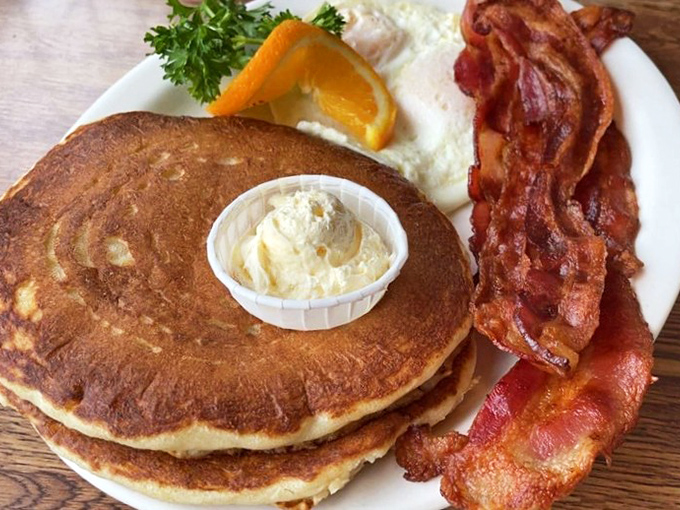 These pancakes aren't just golden brown&mdash;they're the breakfast equivalent of winning the lottery, especially with that crispy bacon alongside.