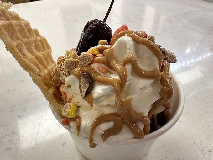 Sundae architecture at its finest. That waffle cone fragment isn't garnish&mdash;it's a structural support beam for this magnificent tower of indulgence.