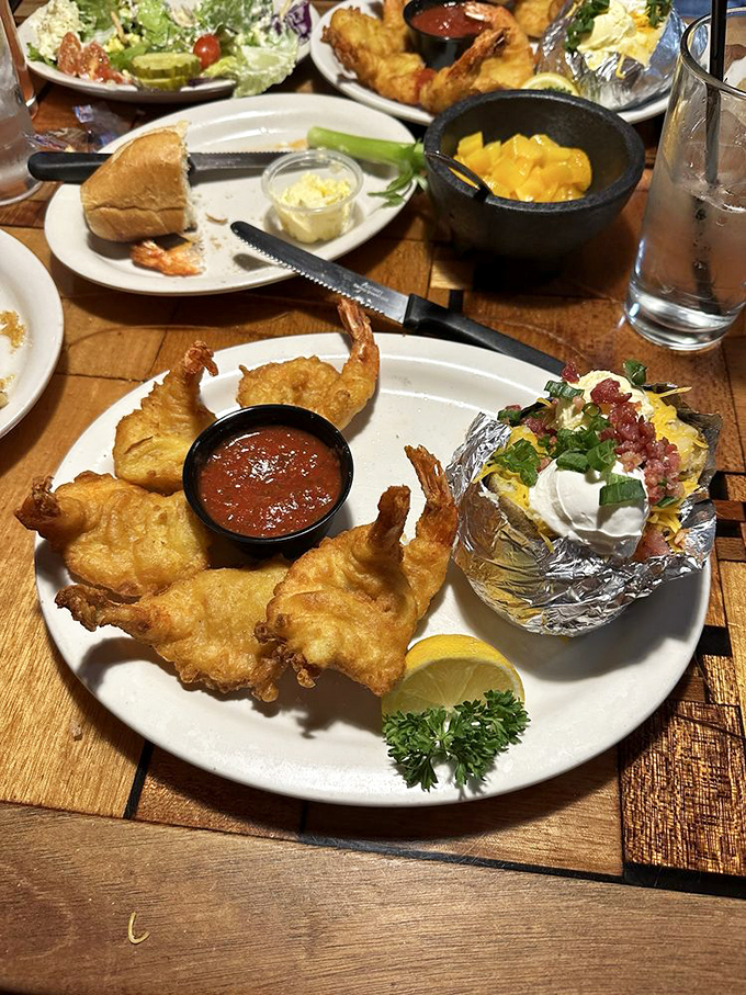 Fried shrimp so perfectly crisp they practically snap, paired with a loaded baked potato that's dressed for a night on the town.
