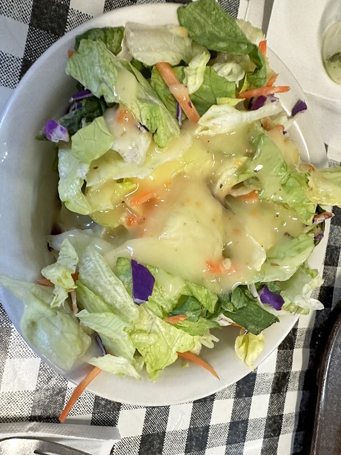 Even the humble house salad gets special treatment here – crisp, colorful, and dressed with the kind of homemade goodness that makes vegetables worth eating.