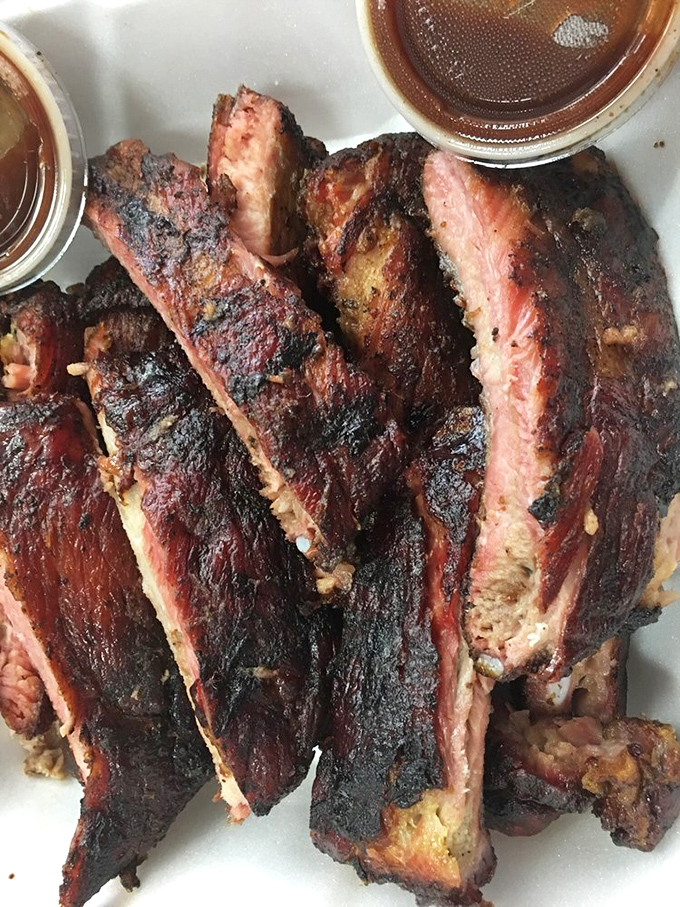 The bark on these ribs is so perfect, it deserves its own appreciation society. That dark exterior is where the magic happens, folks.