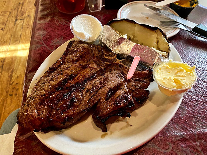 The char marks on this porterhouse tell a story of flame-kissed perfection. The side of shrimp is just showing off.