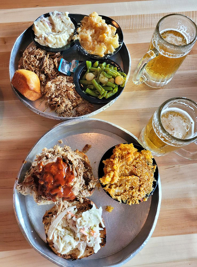 A pulled pork masterpiece with sides that don't know they're supposed to be supporting actors. Cold beer standing by for duty.