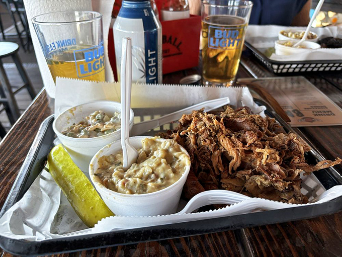 Two perfect sides flank this mountain of pulled pork &ndash; creamy corn and tangy slaw provide the ideal supporting cast to the star protein.