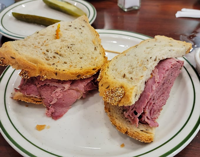 This isn't just a sandwich; it's a monument to the art of proper meat-to-bread ratio. The rye bread provides the perfect stage for this corned beef performance.