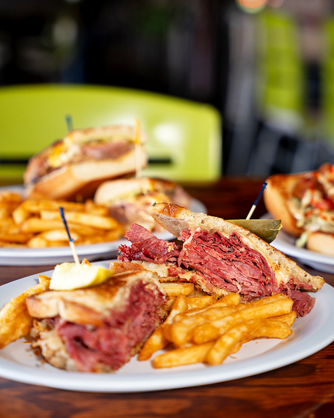 Layer upon glorious layer of meat, melted cheese, and tangy kraut&mdash;this isn't just lunch, it's a religious experience between bread.