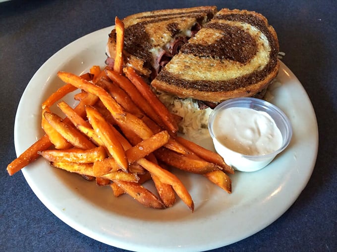 The architectural marvel that is West Cobb's Reuben&mdash;where bread, meat, cheese, and sauerkraut achieve perfect harmony. This isn't lunch; it's edible poetry.