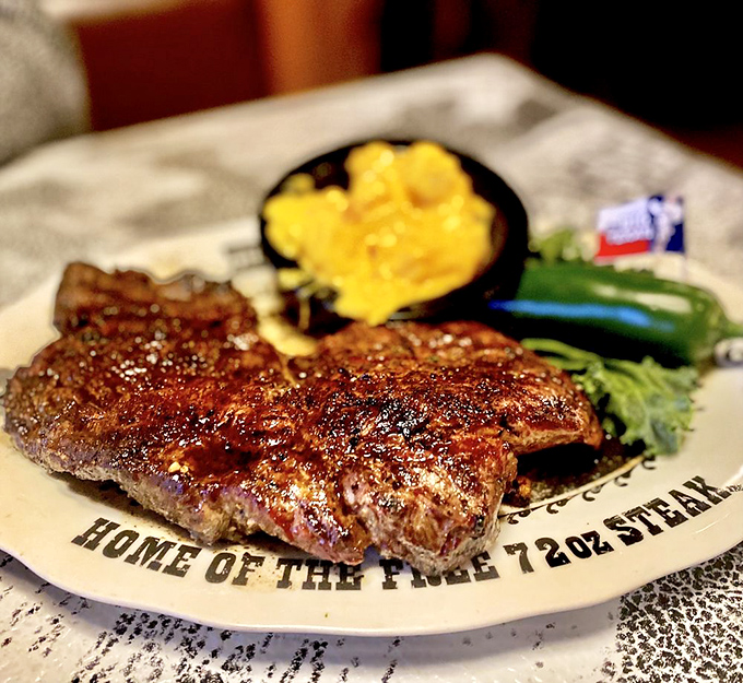 The ribeye arrives with the fanfare it deserves—seared to perfection and resting beside a baked potato that's practically begging for attention.