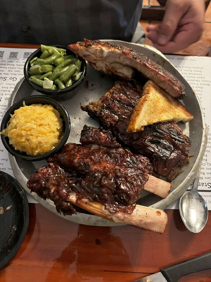 The barbecue equivalent of a perfect sunset: glistening ribs with that mahogany bark, paired with cooling slaw and beans that mean business.