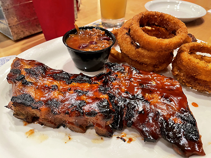 Ribs and onion rings: a partnership more beautiful than Bogart and Bacall, with sauce that demands to be the star of the show.