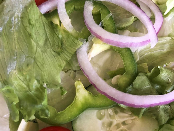 A garden salad that actually deserves the name&mdash;crisp, fresh, and vibrant enough to momentarily distract you from the pizza. 