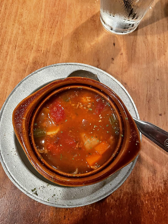 This isn't just soup—it's seafarer's chowder that tells tales of Atlantic voyages in every spoonful of its hearty, vegetable-studded broth.