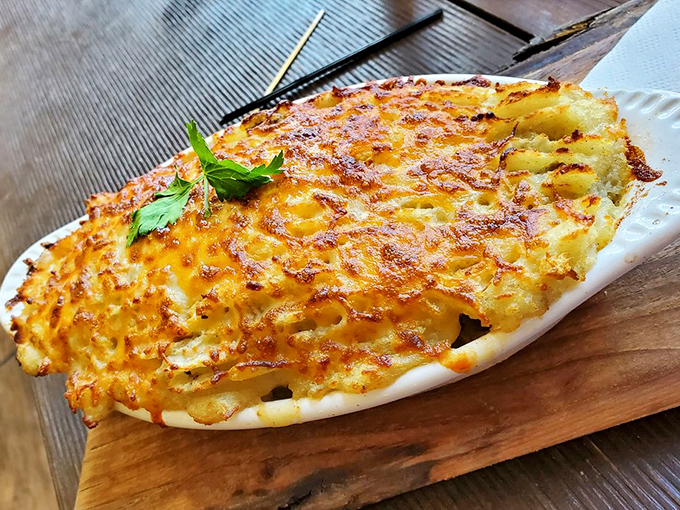 Golden, bubbling cheese creates a landscape so beautiful you almost feel guilty disturbing it. Almost.