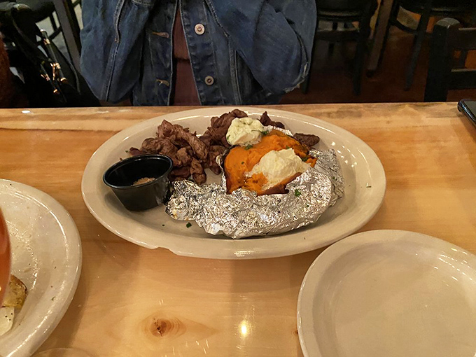 Steak bites with a loaded potato that's dressed better than I am most days. This is what happens when side dishes refuse to be sidelined.