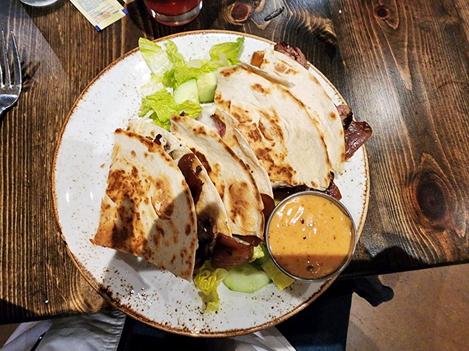 Quesadillas with attitude—where steak meets cheese in a tortilla tango so perfect you'll momentarily forget your table manners.