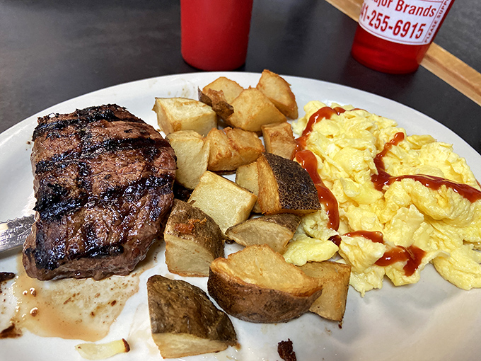 The holy trinity of breakfast: a perfectly seared steak, fluffy eggs, and potatoes that crunch like autumn leaves. 