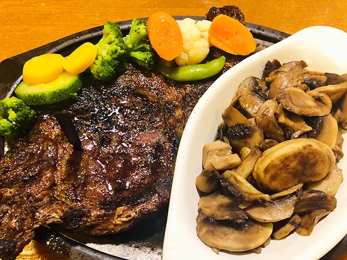 This ribeye shares the spotlight with saut&eacute;ed mushrooms, creating a duet so harmonious it deserves its own Grammy.