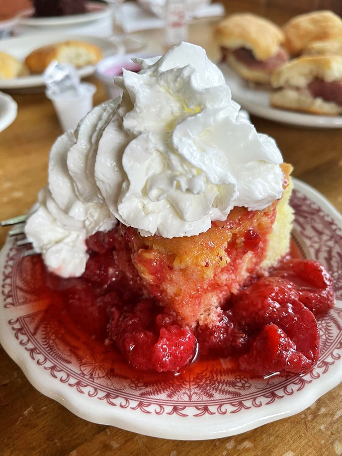 A cloud of whipped cream crowns ruby-red strawberry shortcake&mdash;the perfect sweet finale to a meal built on tradition.