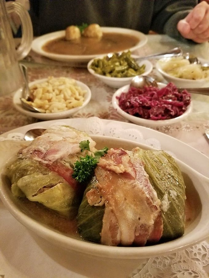 Stuffed cabbage rolls wrapped like precious gifts, surrounded by a supporting cast of traditional sides. German grandmothers everywhere are nodding in approval.