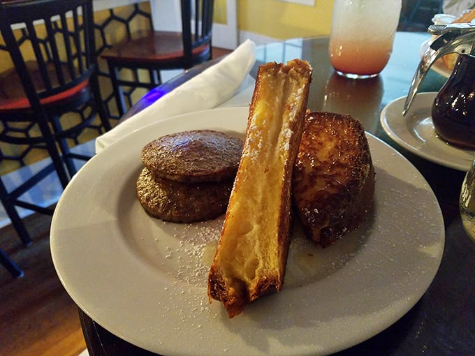French toast engineering at its peak&mdash;crispy edges giving way to creamy centers. That sausage patty is the breakfast equivalent of a supporting actor Oscar.